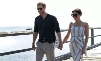 Meghan Markle och prins Harry håller varandra i hand