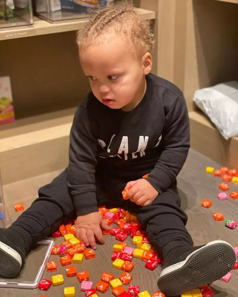 Ayesha at Stephen Curry Son Canon Sits with Starbursts