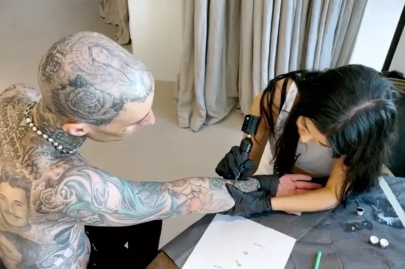 Kourtney-Tattooing-Travis